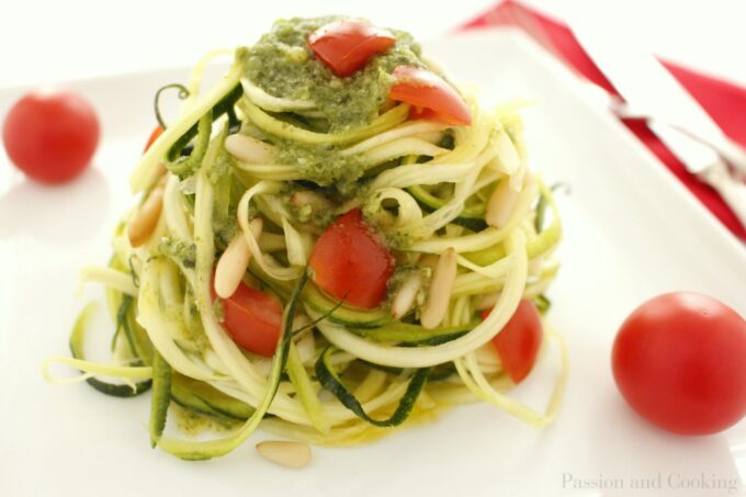 Zucchini spaghetti with pesto and cherry tomatoes